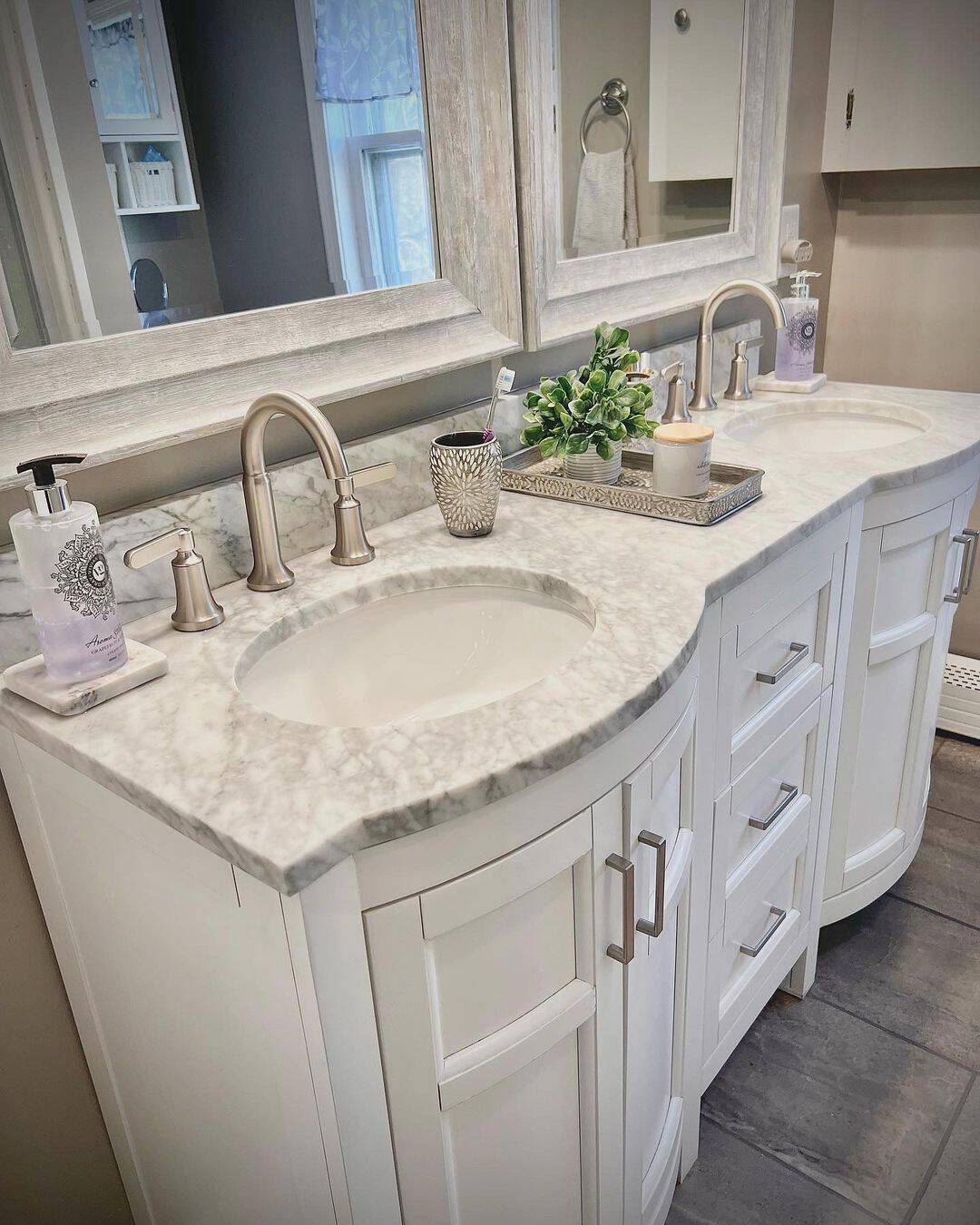 30 Clever Ways To Decorate the Space Between Bathroom Sinks